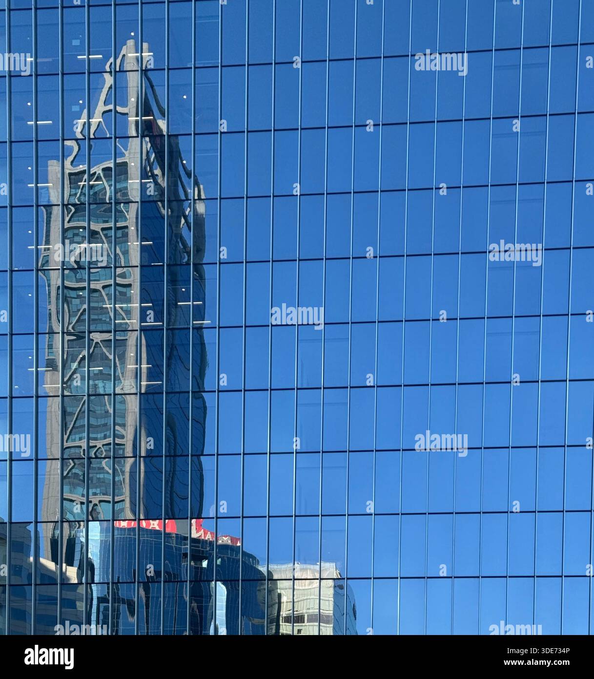 Reflection of BHP Brookfield Place tower in the glace facade of another ...