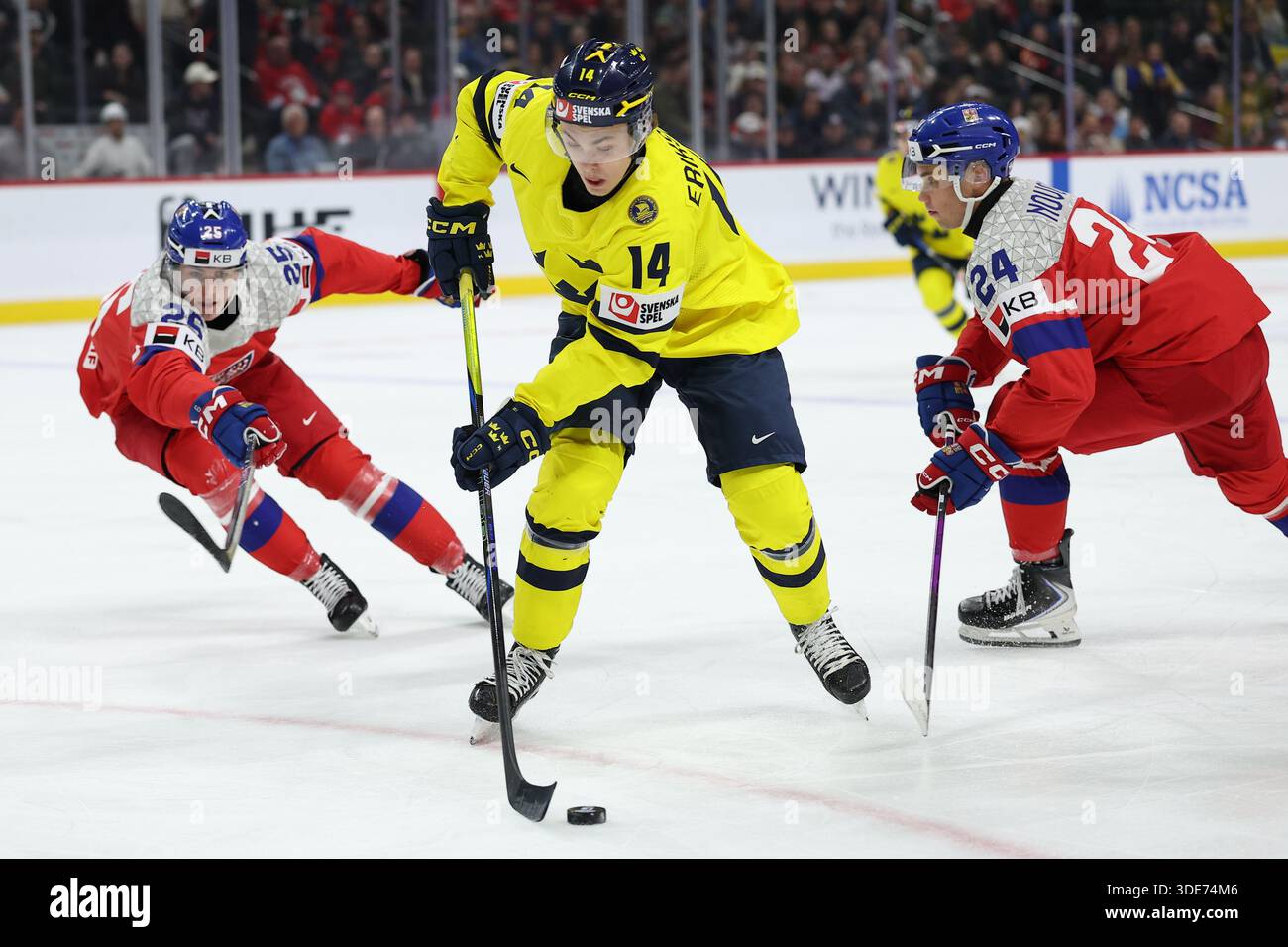 Sweden Linus Eriksson (14) controls the puck against Czechia forward ...