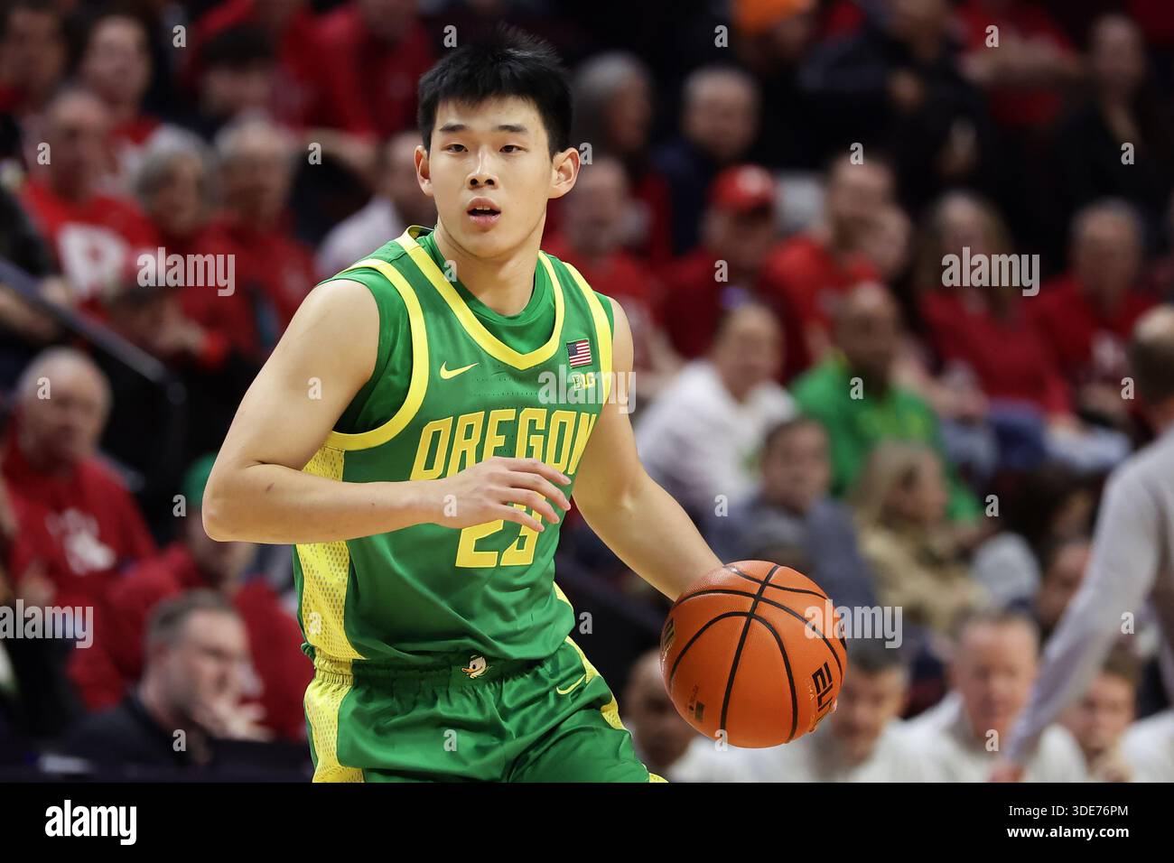 Oregon guard Wei Lin (23) dribbles during the first half of an NCAA ...