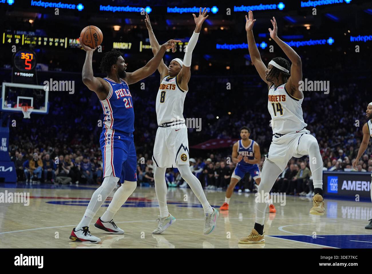 Philadelphia 76ers' Joel Embiid (21) looks to shoot against Denver ...