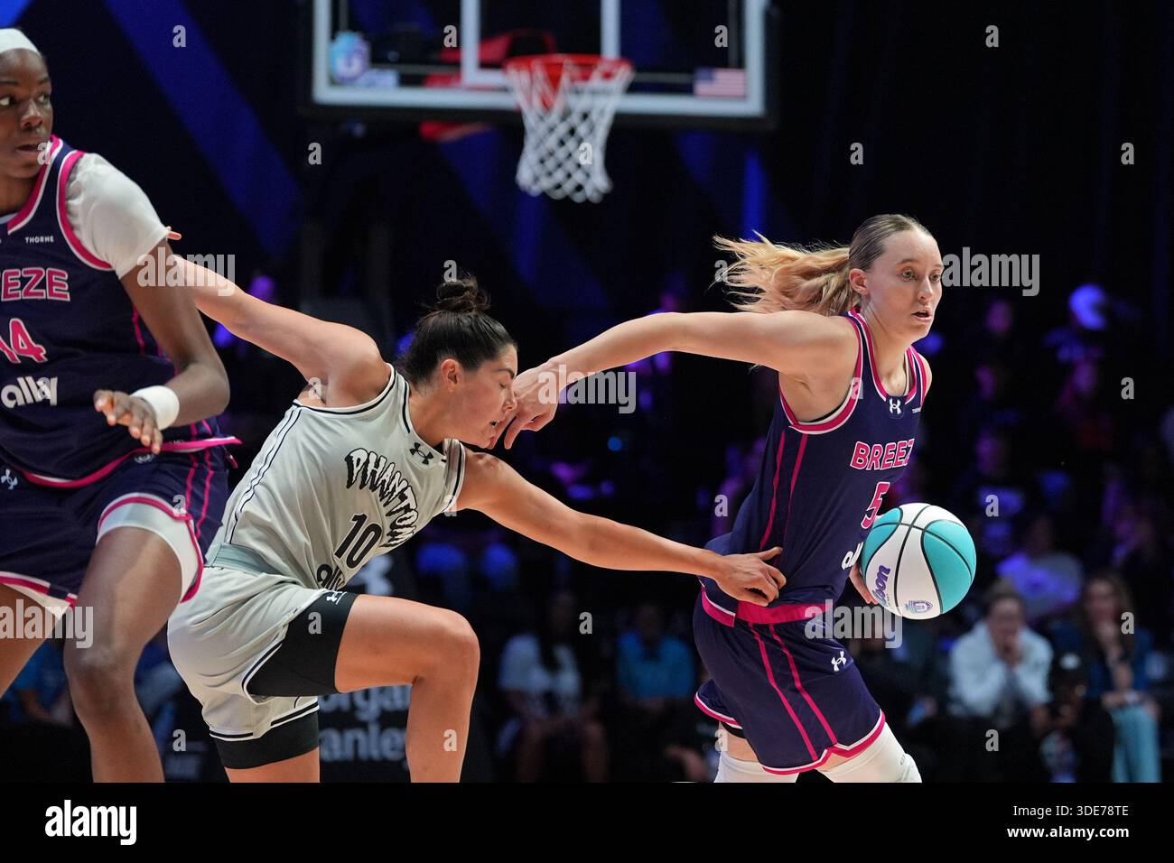 Breeze BC guard Paige Bueckers (5) is pursued by Phantom BC guard ...