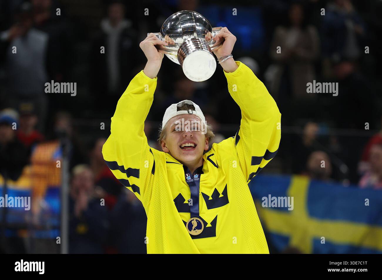 Sweden Jack Berglund holds the trophy after winning an IIHF World ...