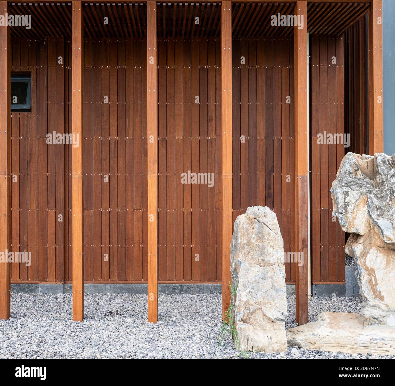 Architectural detail of a building facade featuring vertical wooden ...