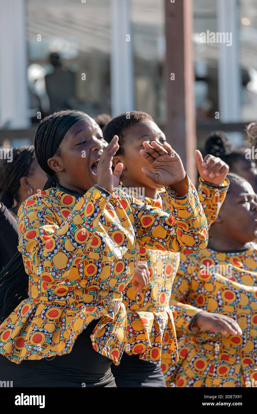 Group of women from a musical choir singing outdoors in traditional ...