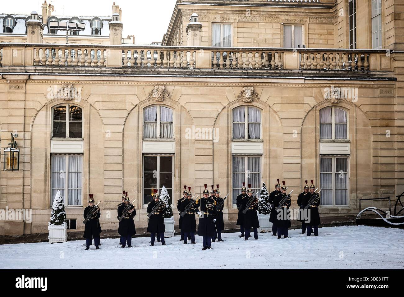 Republican Guards wait in the snow covered courtyard of the Elysee ...