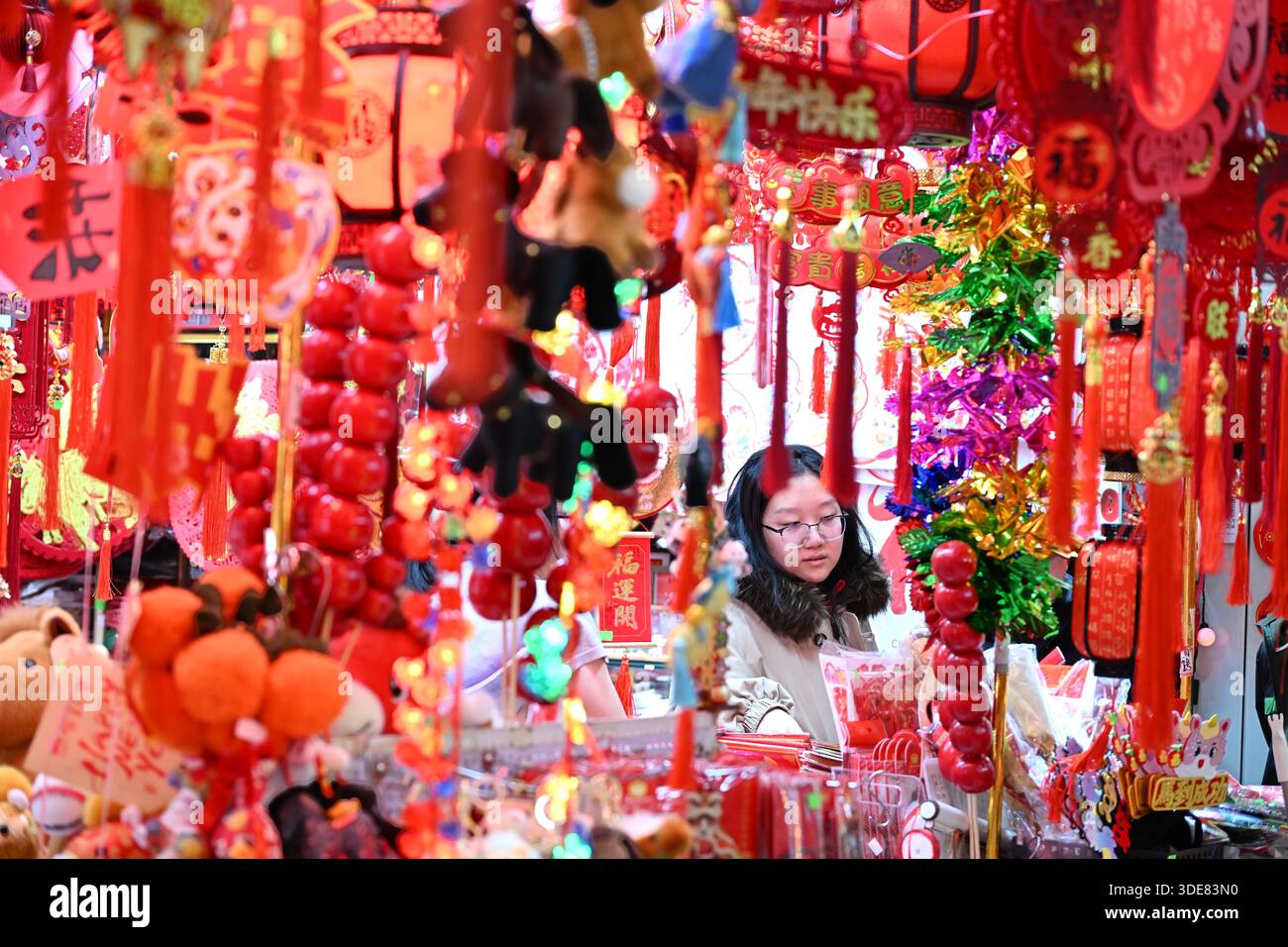 Residents select Spring Festival decorations at a market in Beijing ...