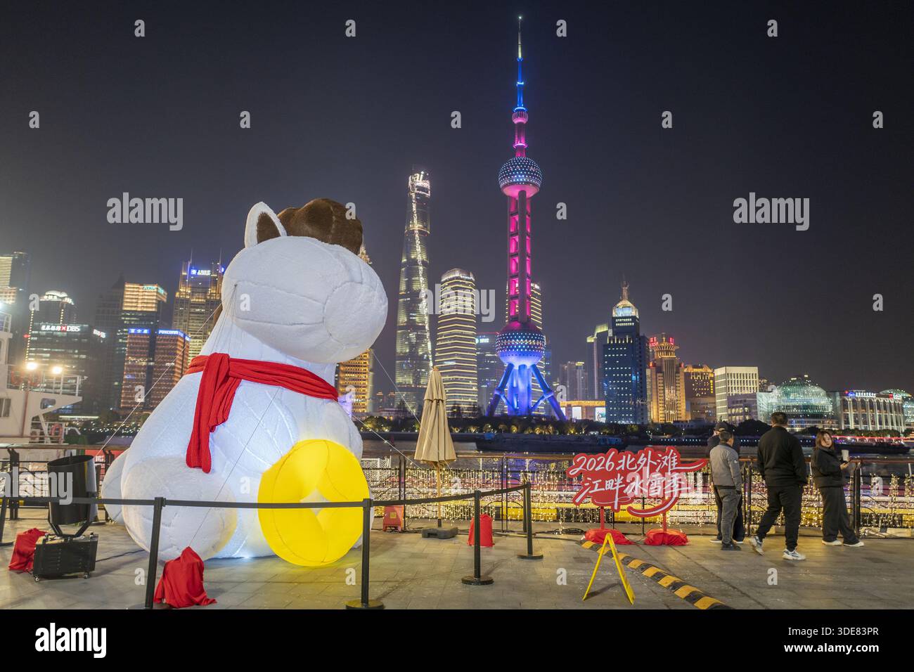 Visitors enjoy ice and snow fun at the North Bund in Shanghai, China ...