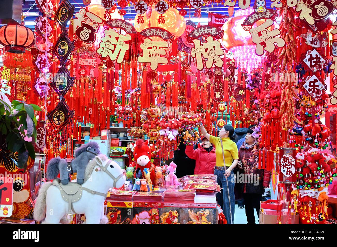 Residents select Spring Festival decorations at a market in Beijing ...