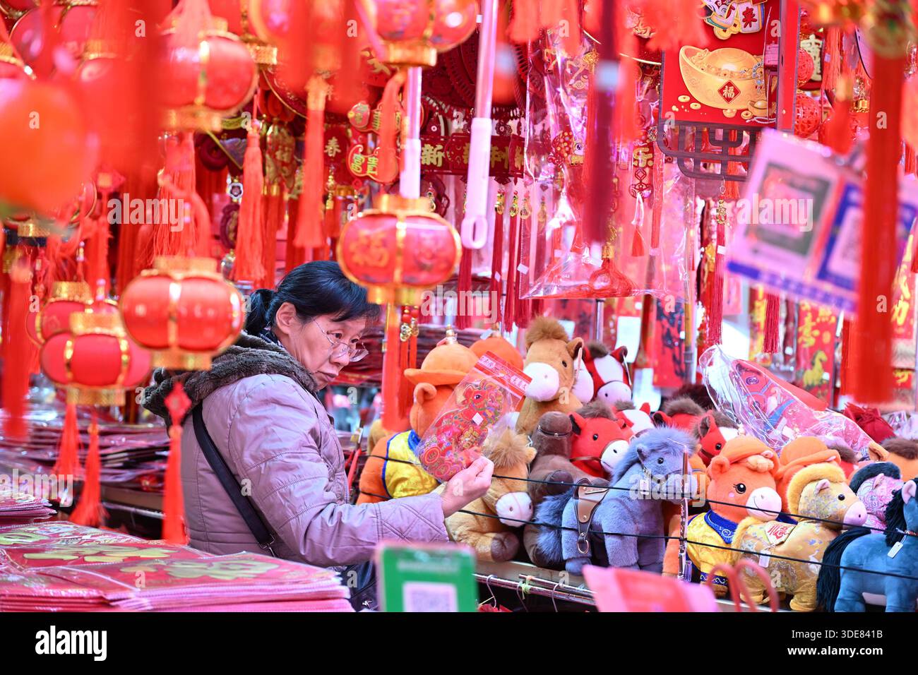 Residents select Spring Festival decorations at a market in Beijing ...