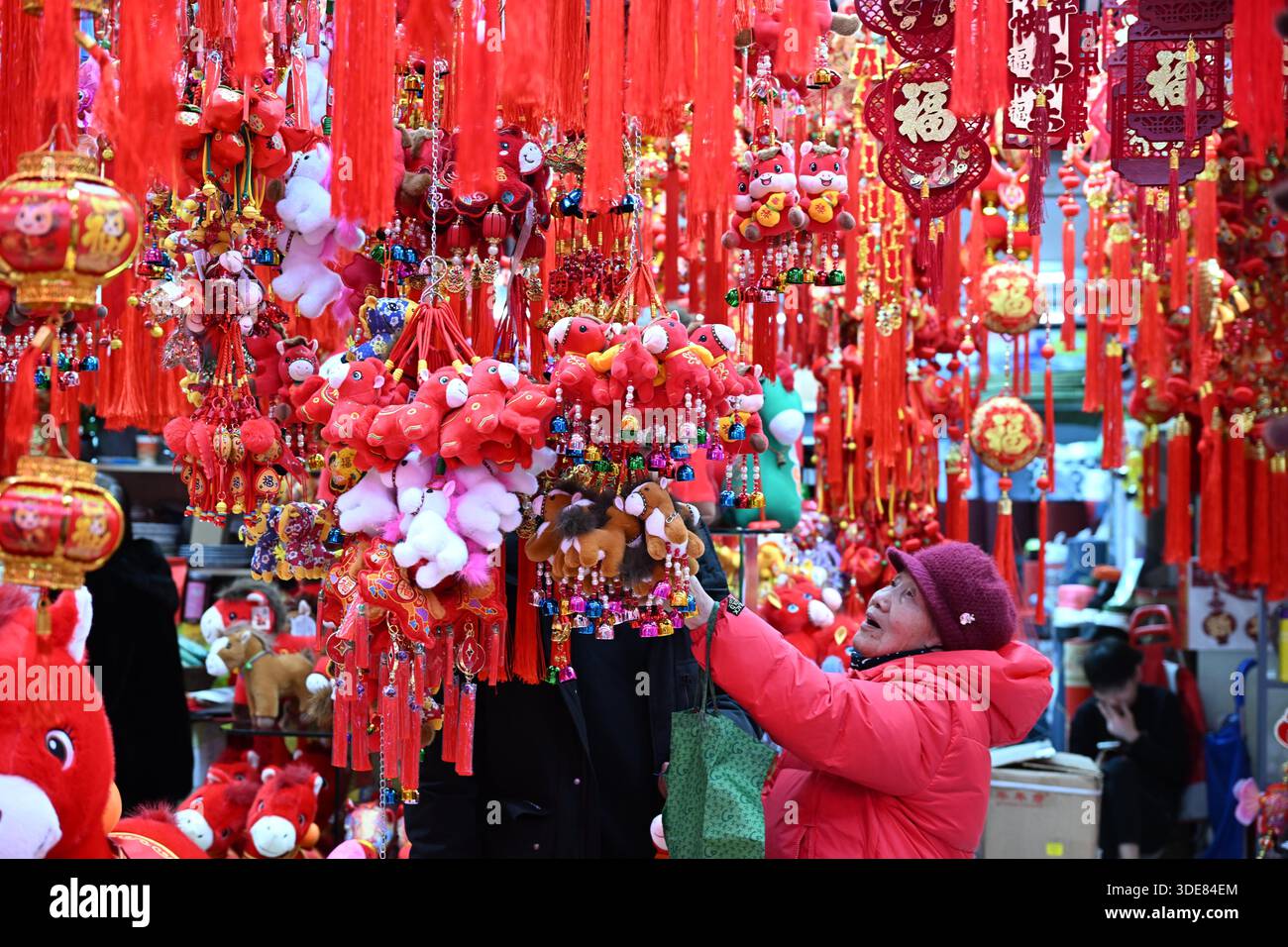 Residents select Spring Festival decorations at a market in Beijing ...