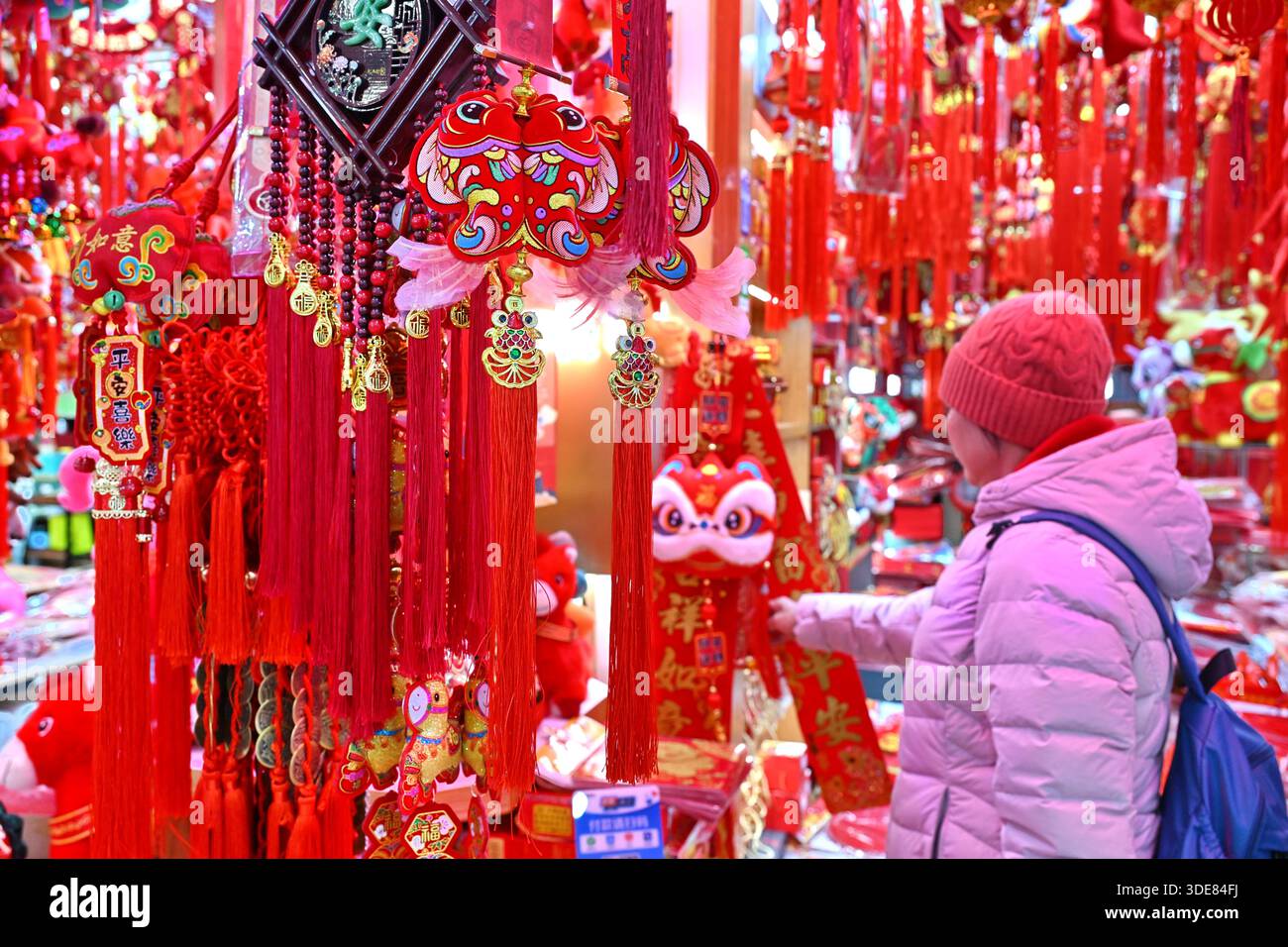 Residents select Spring Festival decorations at a market in Beijing ...