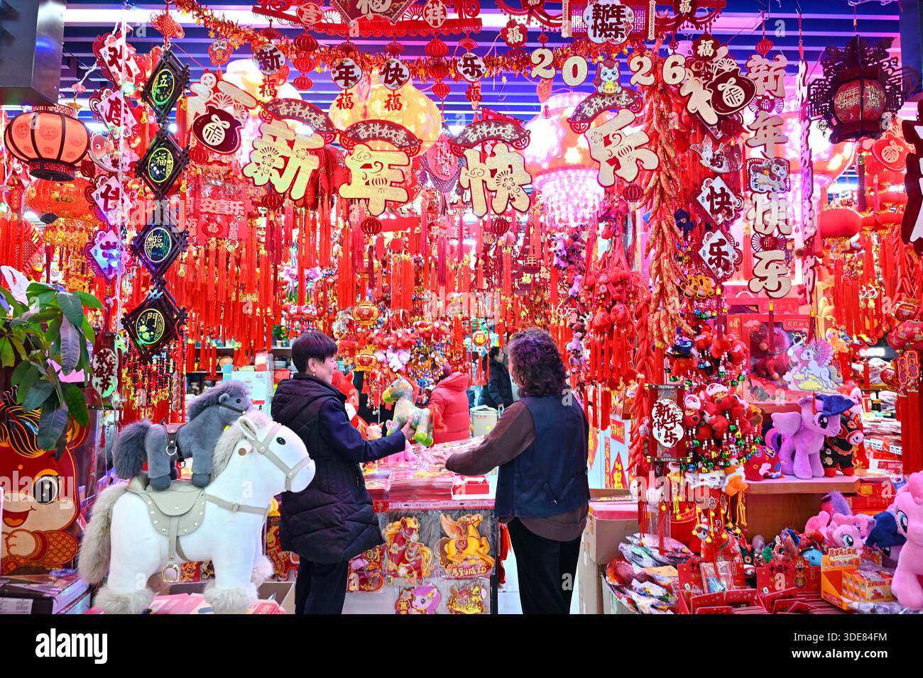 Residents select Spring Festival decorations at a market in Beijing ...