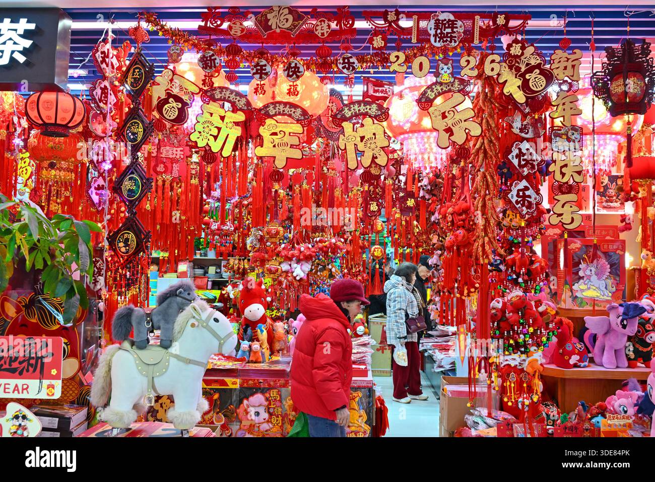 Residents select Spring Festival decorations at a market in Beijing ...