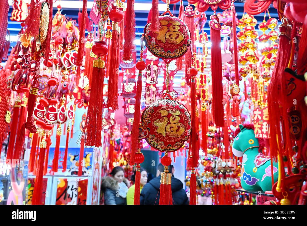 Residents select Spring Festival decorations at a market in Beijing ...