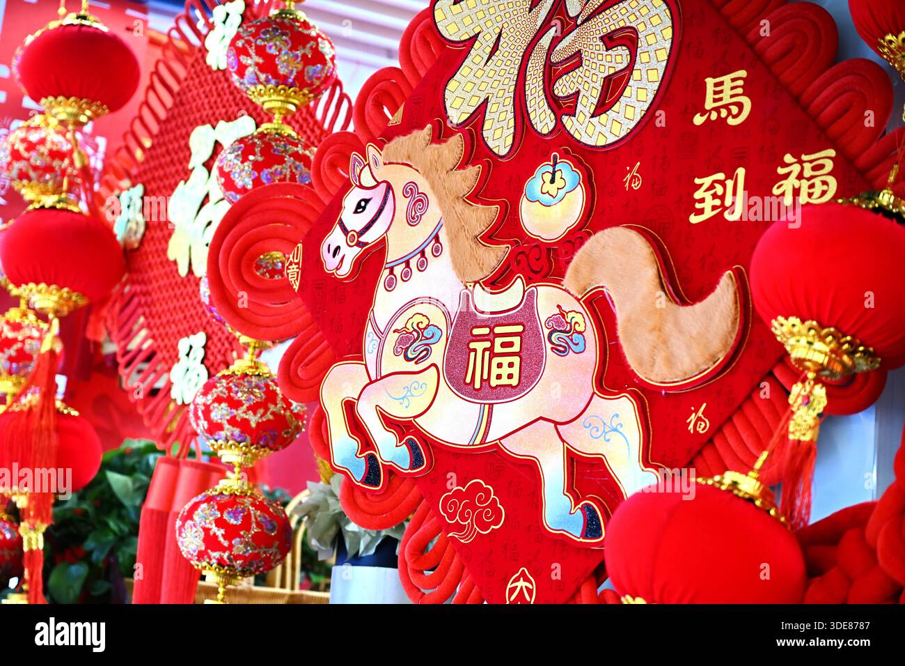 Residents select Spring Festival decorations at a market in Beijing ...