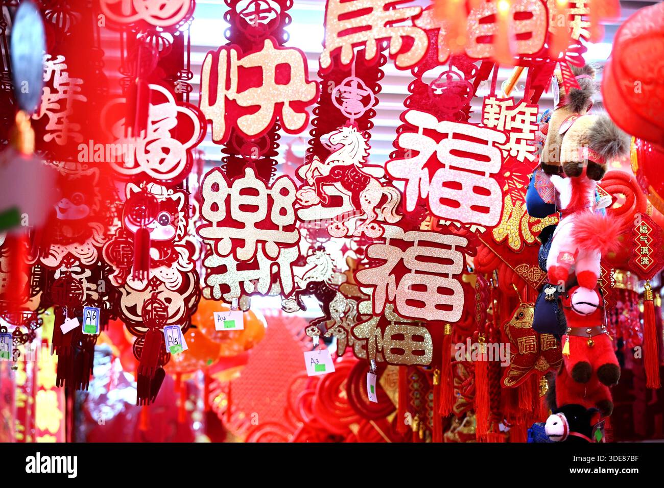 Residents select Spring Festival decorations at a market in Beijing ...