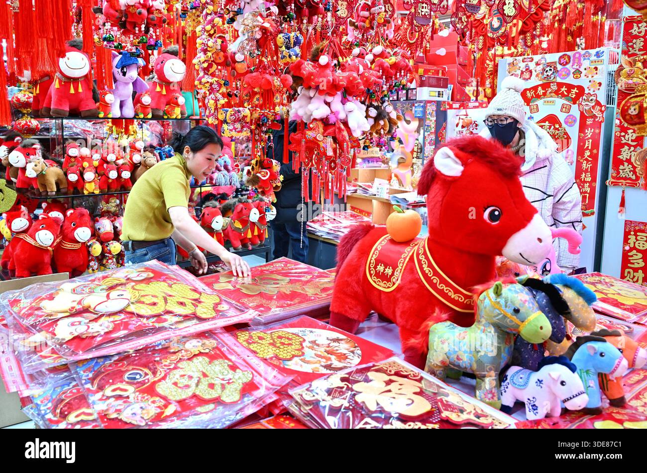Residents select Spring Festival decorations at a market in Beijing ...