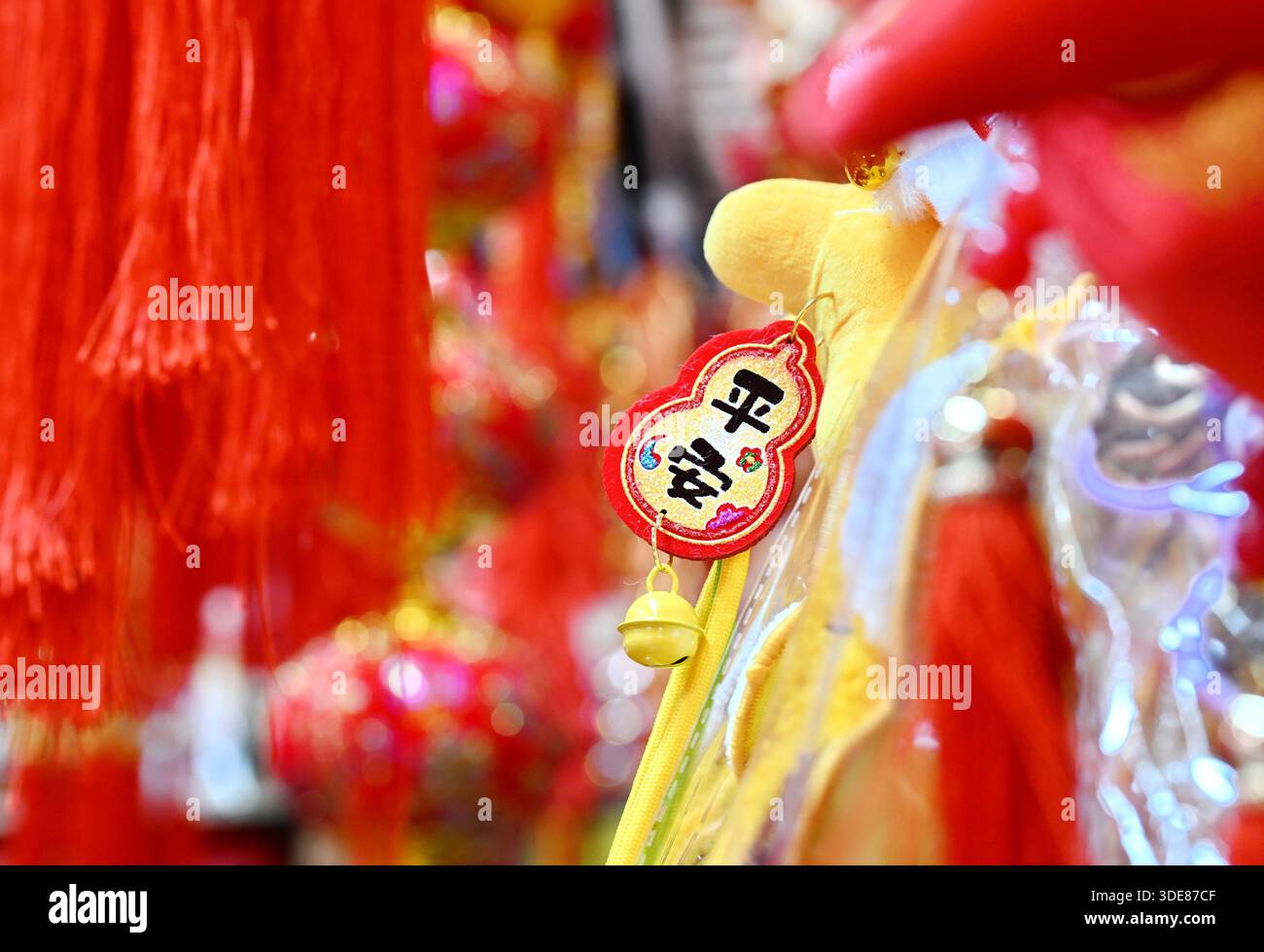 Residents select Spring Festival decorations at a market in Beijing ...
