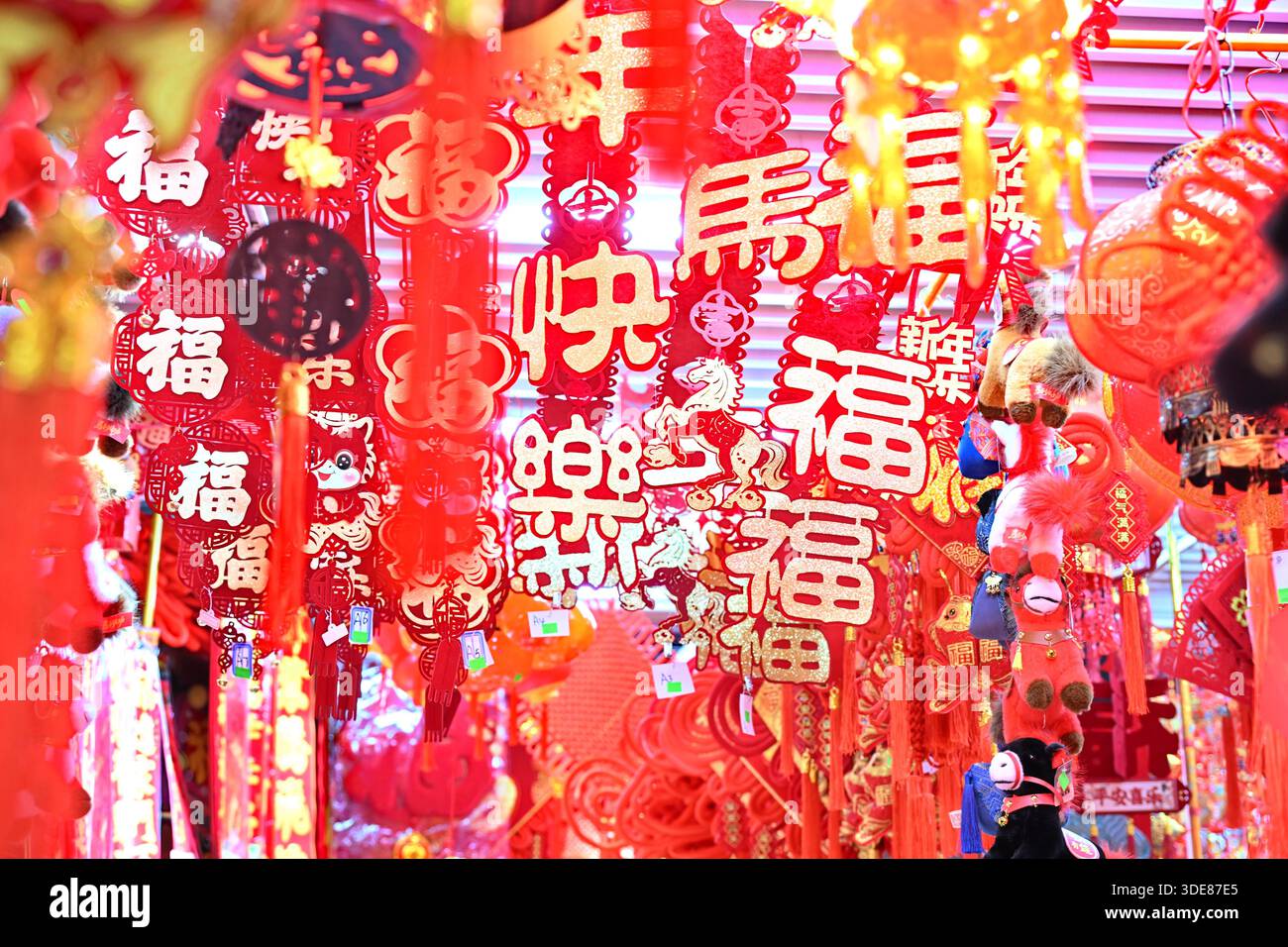 Residents select Spring Festival decorations at a market in Beijing ...