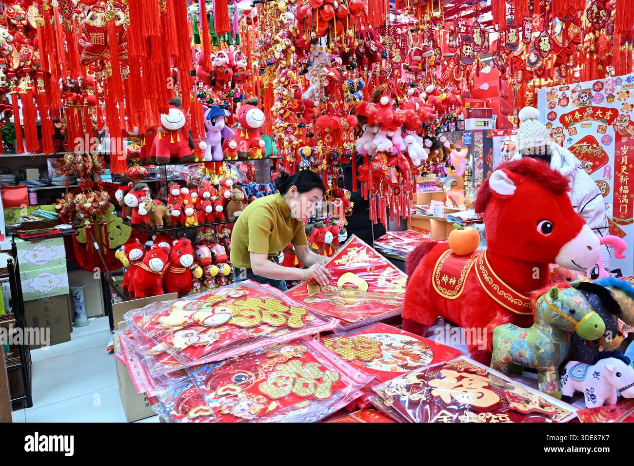 Residents select Spring Festival decorations at a market in Beijing ...