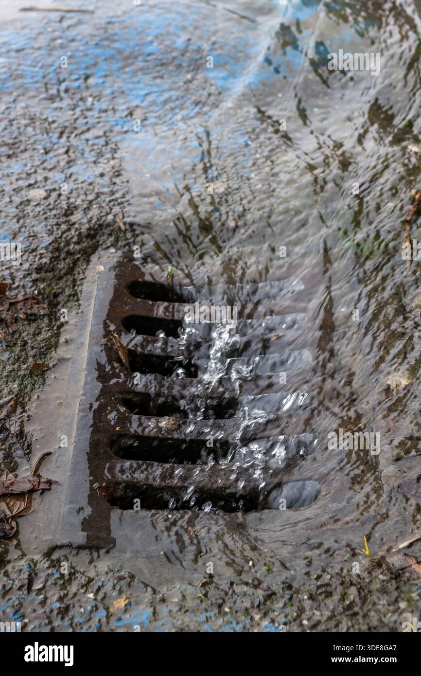 Rain water flows down a storm drain in Bantry, West Cork, Ireland Stock ...