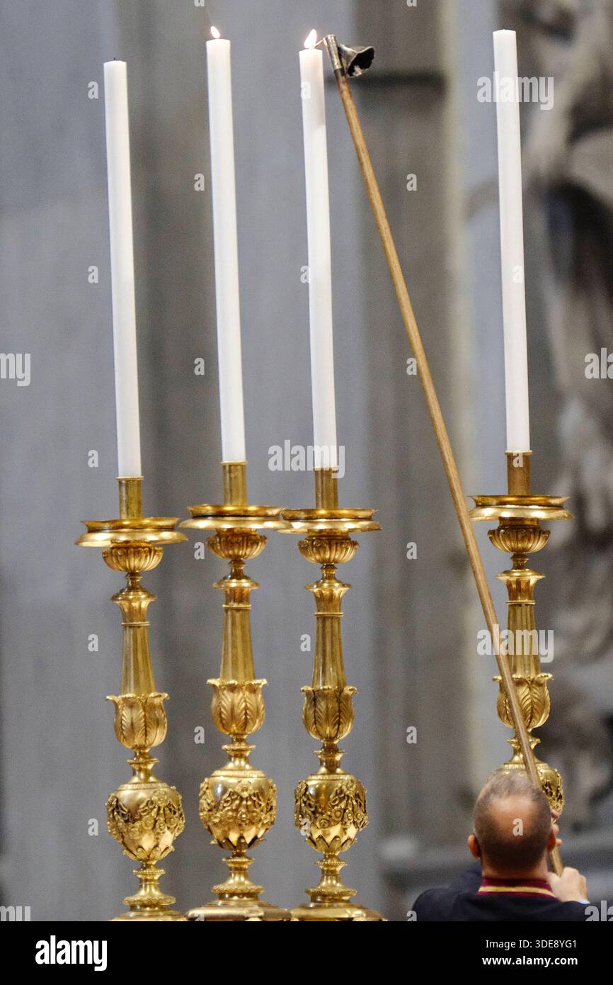 Epiphany 2026: Church officials prepare the altar, lighting the candles ...