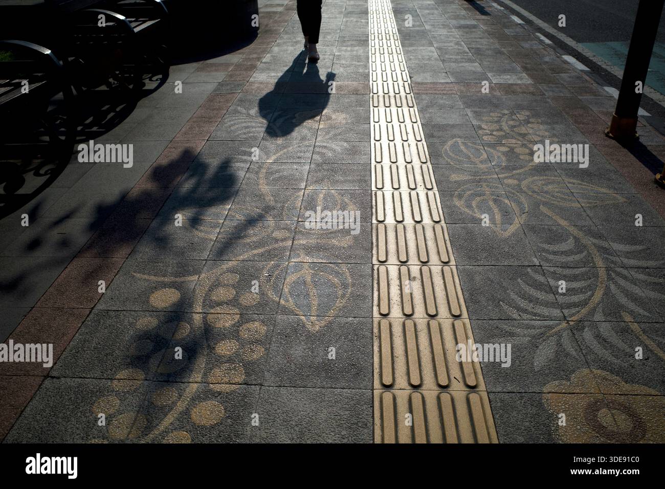Yellow tactile paving for blind people or visually impaired on the ...