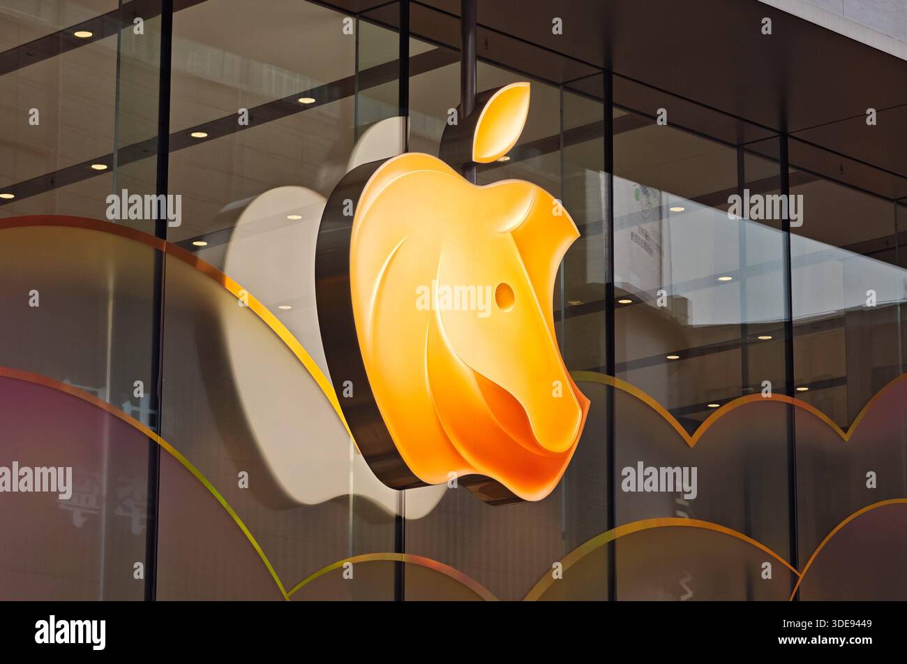 The Apple logo turns orange at an Apple Store in a promotional event in ...