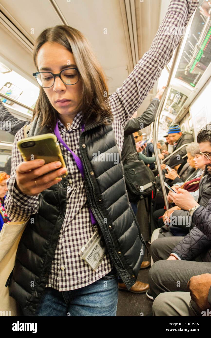 Female Commuter with Smartphone. Female commuter hanging around the ...