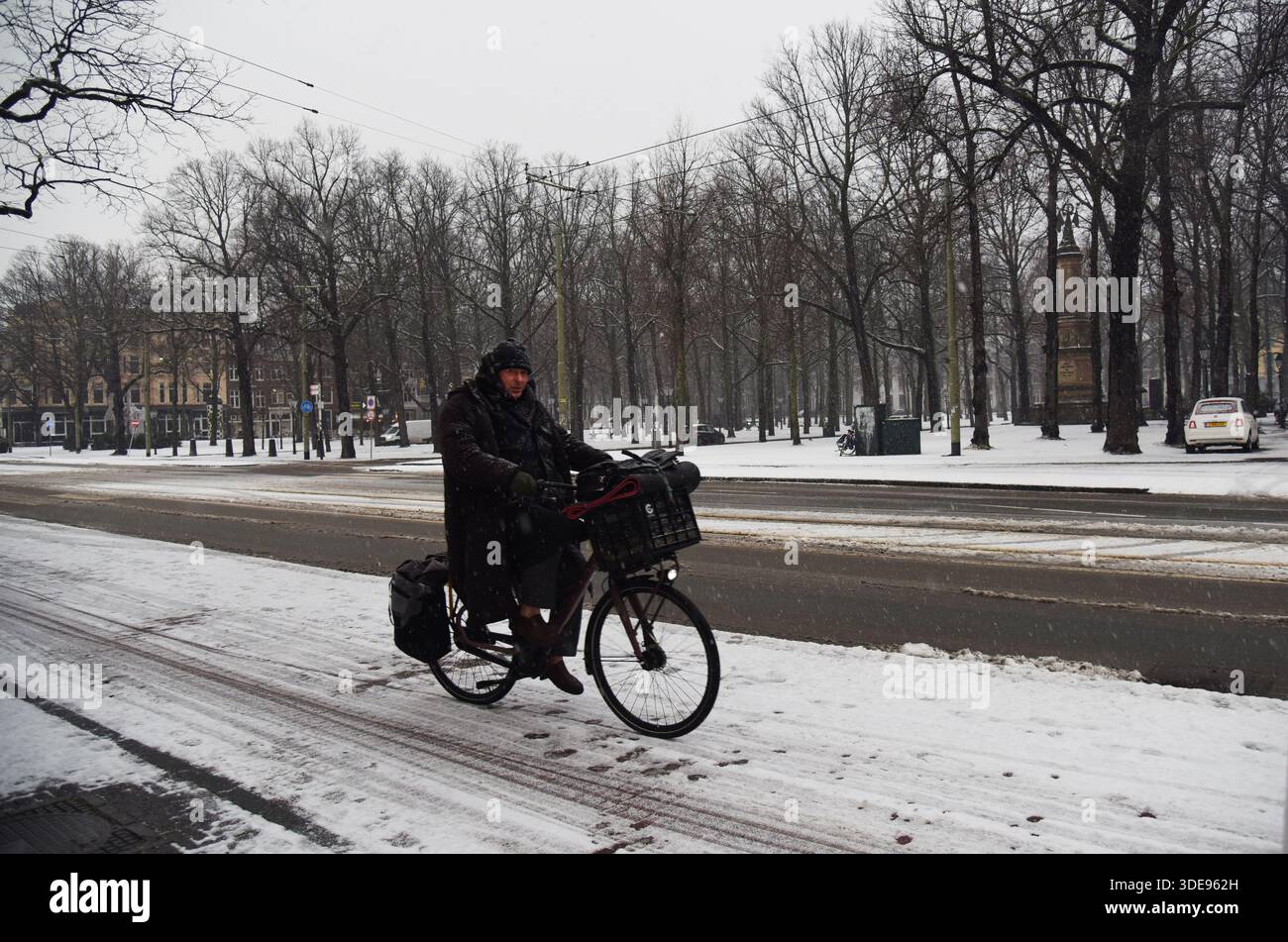 (260106) -- THE HAGUE, Jan. 6, 2026 (Xinhua) -- A man rides a bike in the Hague, the Netherlands ...