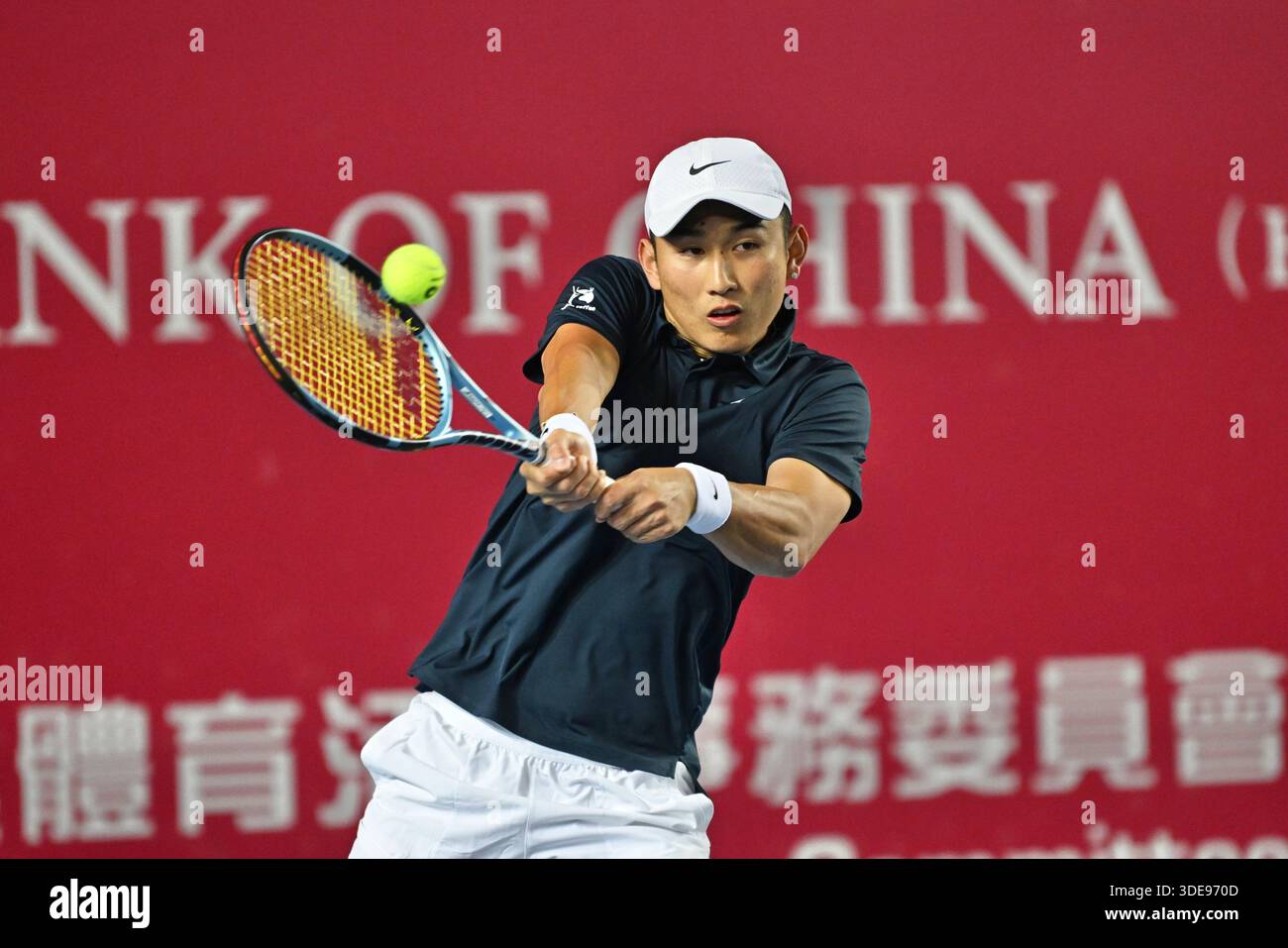 Juncheng Shang ,a Chinese tennis player, during a match at the Hong ...