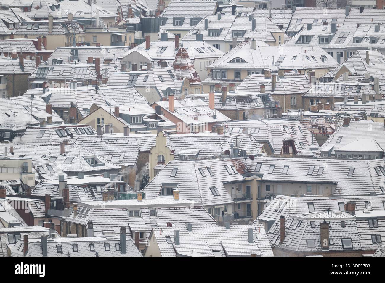 06 January 2026, Baden-Württemberg, Stuttgart: Snow-covered roofs can ...