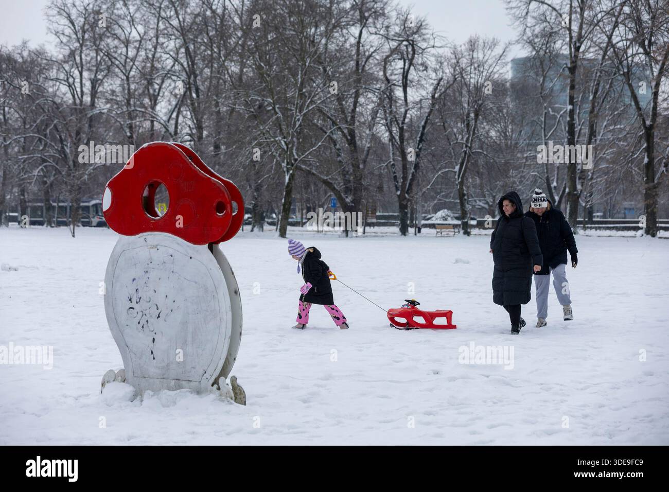 People ride on a sledge in a snow-covered Osijek, Croatia on January 6 ...