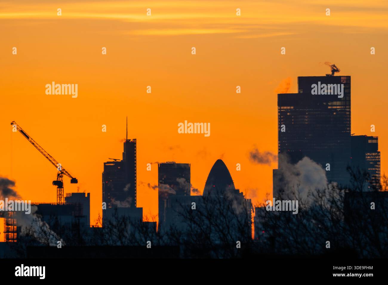 London, UK. 6th Jan, 2026. The sky glows orange as the Sun rises in ...
