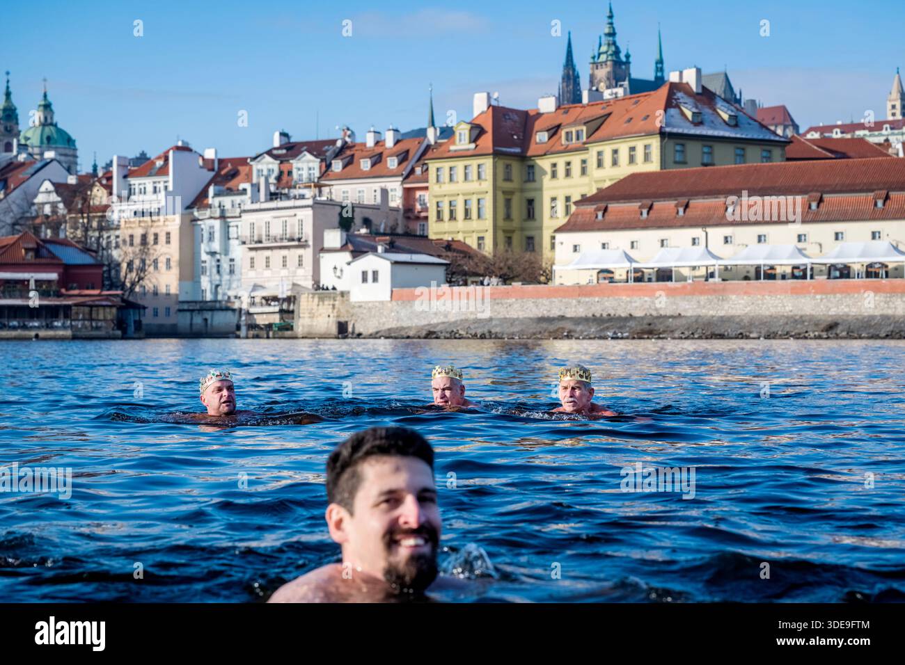 Winter swimmers take part in the traditional Three Kings swim in the ...