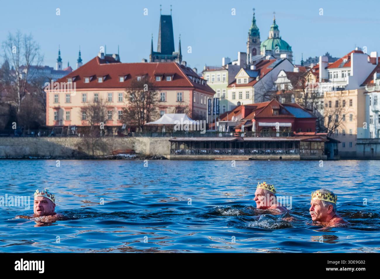 Winter swimmers take part in the traditional Three Kings swim in the ...