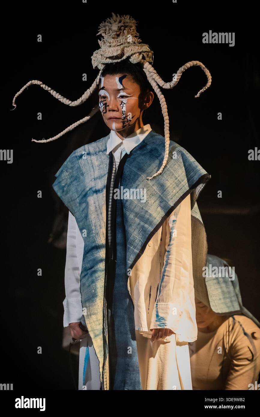 A contemporary performance portrait featuring a model in avant-garde ...