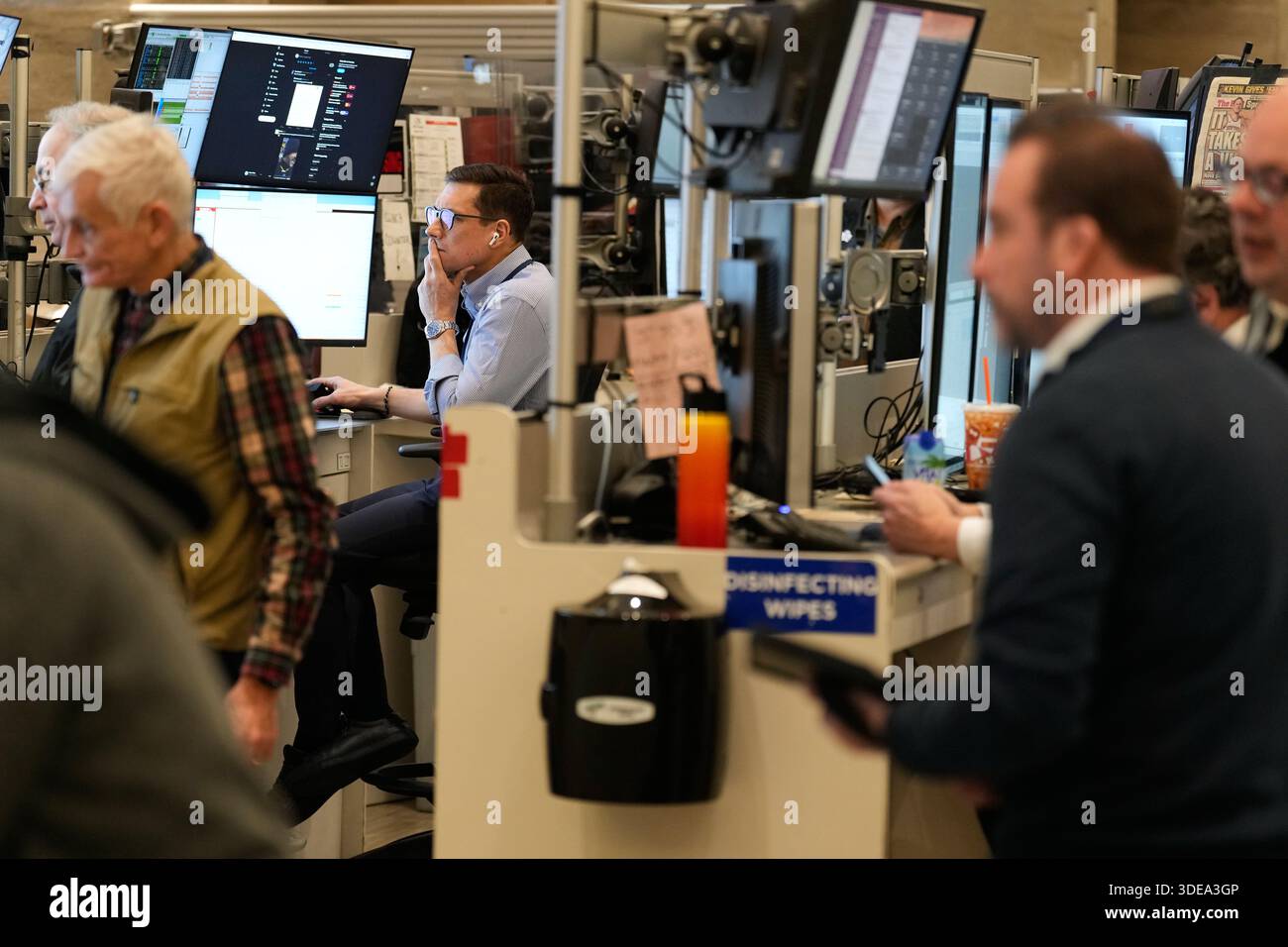 Traders work on the floor at the New York Stock Exchange in New York ...