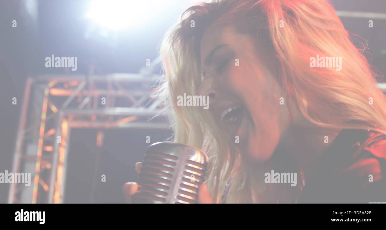 Singing female performer gripping hi-res stock photography and images ...