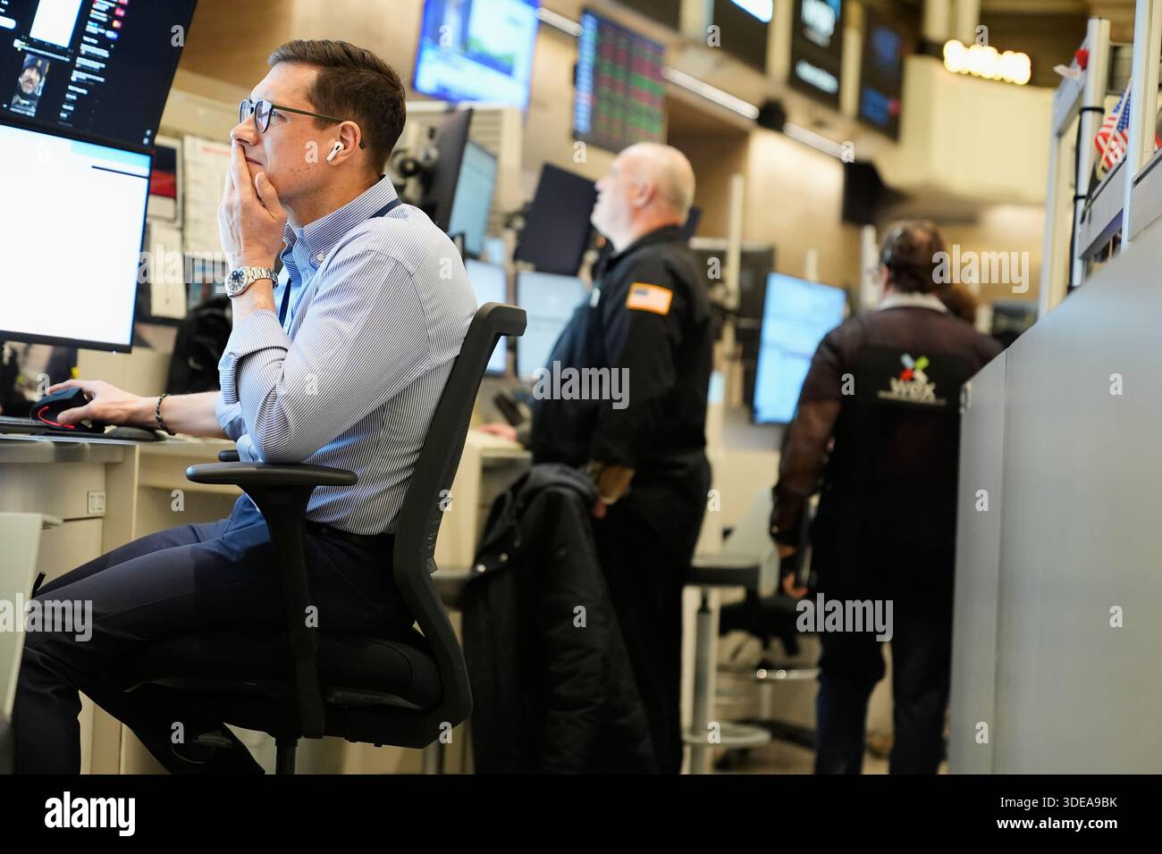 Traders work on the floor at the New York Stock Exchange in New York ...