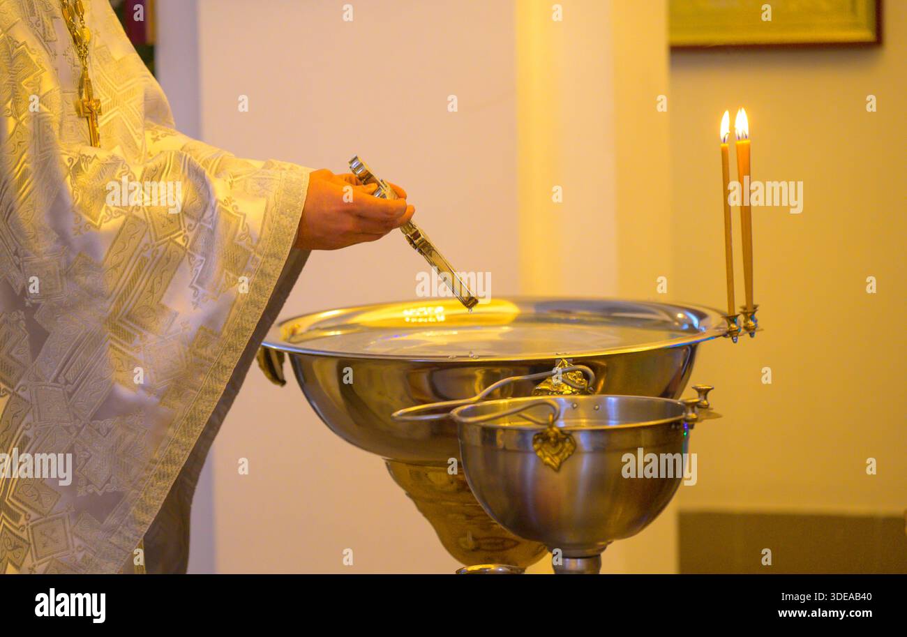 Kyiv, Ukraine 6th January,2026, Orthodox priest in golden vestments ...