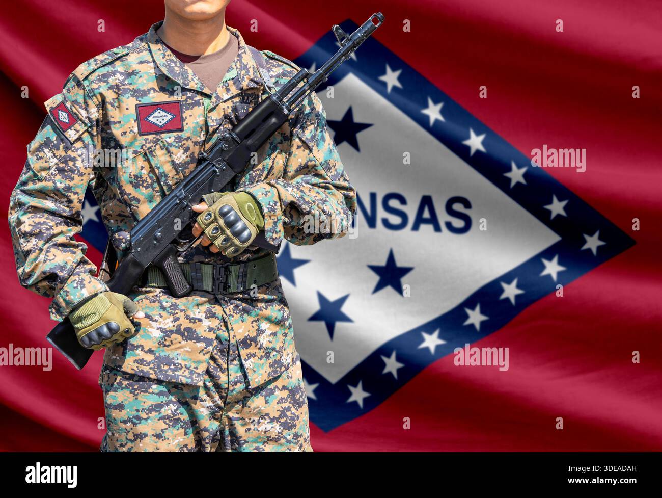 Arkansas US state flag with soldier in military uniform holding assault ...