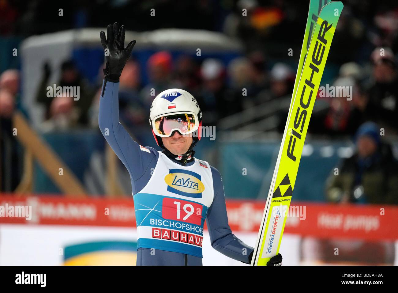 Kamil Stoch, of Poland, who is retiring, waves to the fans after during ...