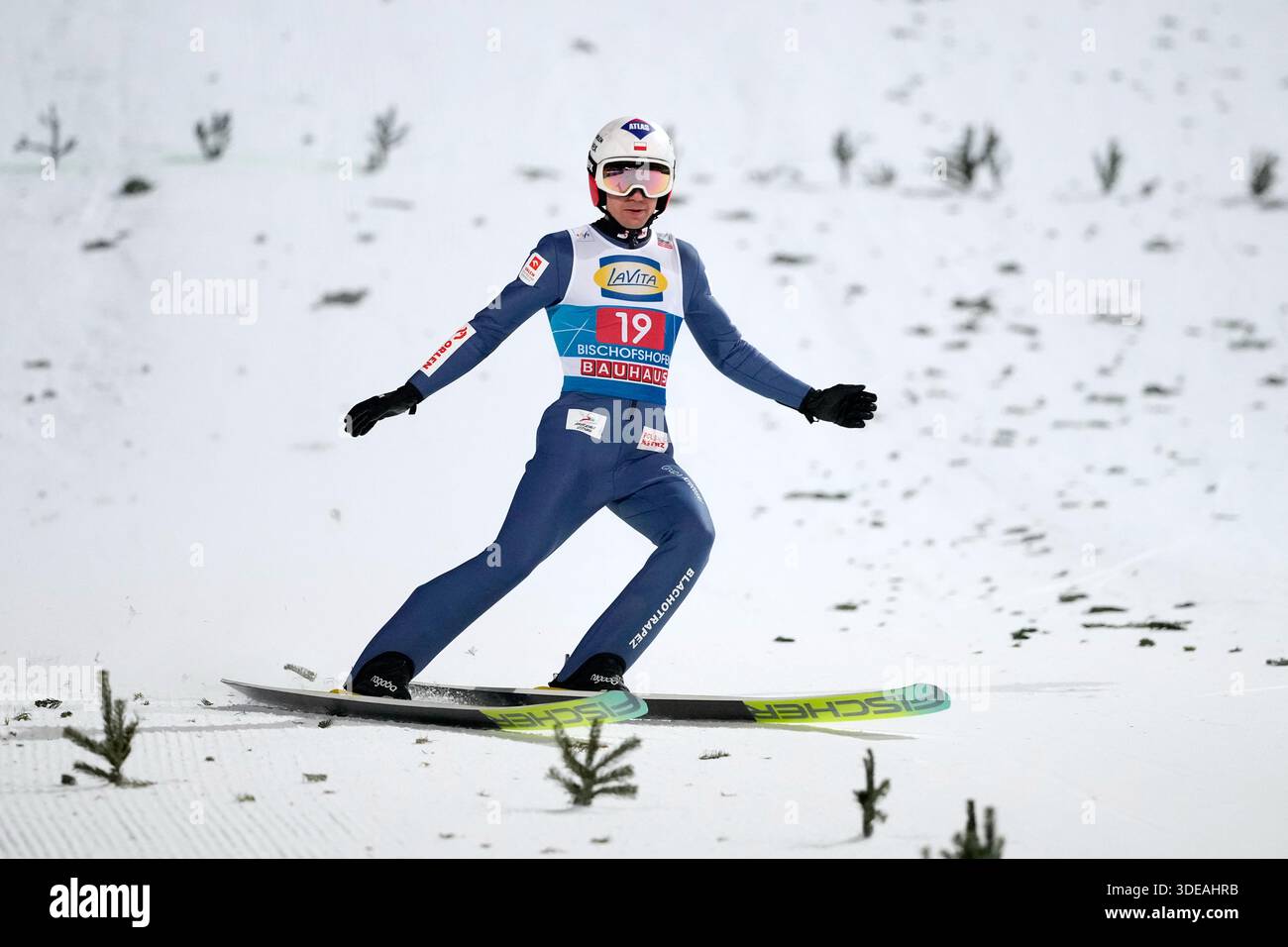 Kamil Stoch, of Poland, who is retiring, brakes in the finish area ...