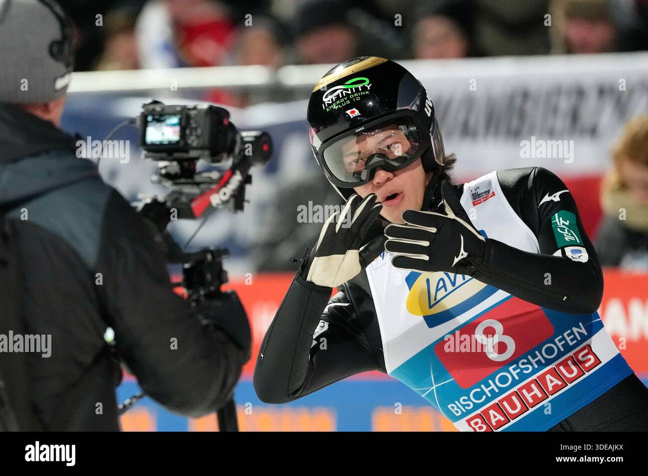 Ren Nikaido, of Japan, reacts after during his second round jump at the ...