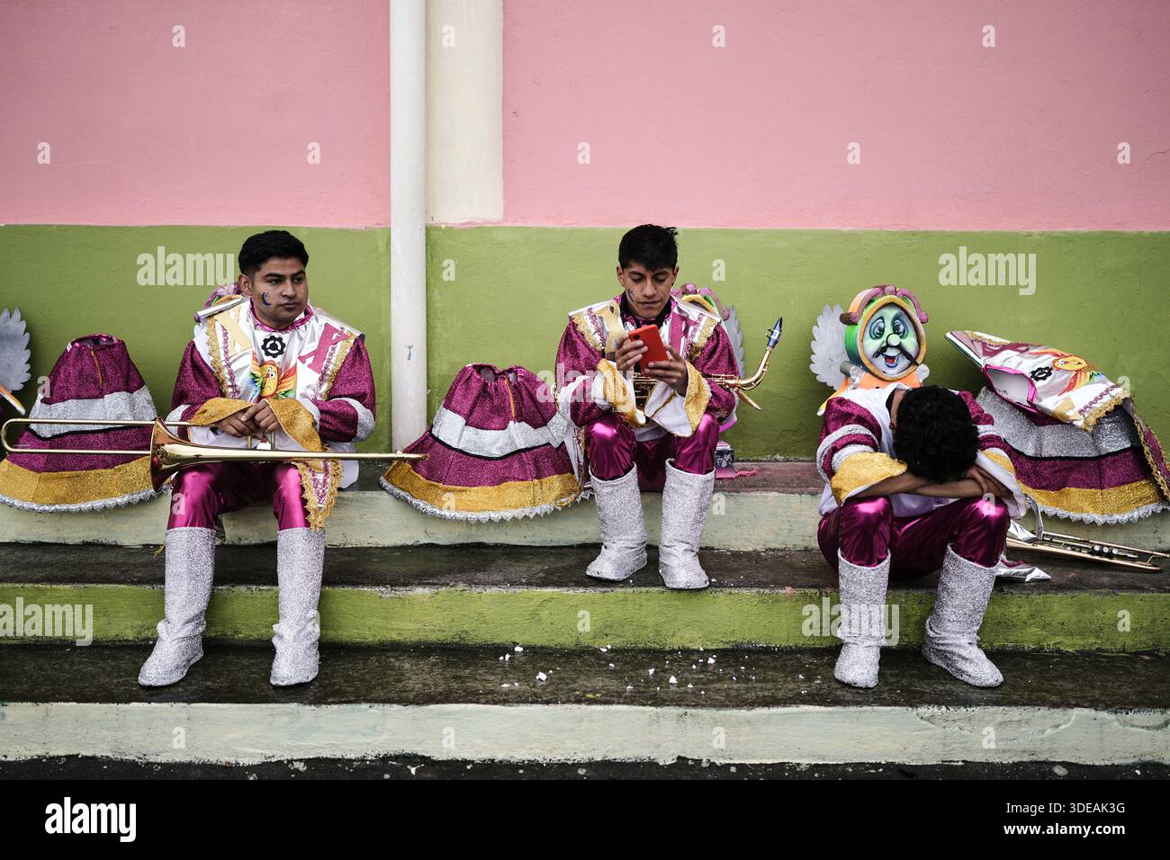 Revelers rest prior to the start of the Black and White Carnival ...