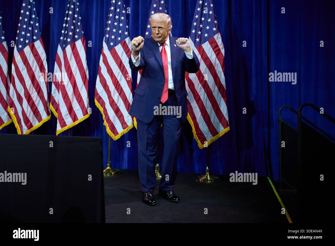 President Donald Trump dances as he walks off stage after speaking to ...