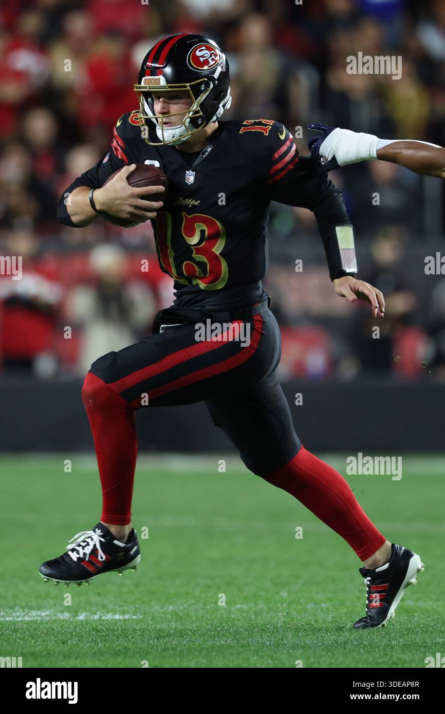 San Francisco 49ers quarterback Brock Purdy (13) runs against Seattle ...