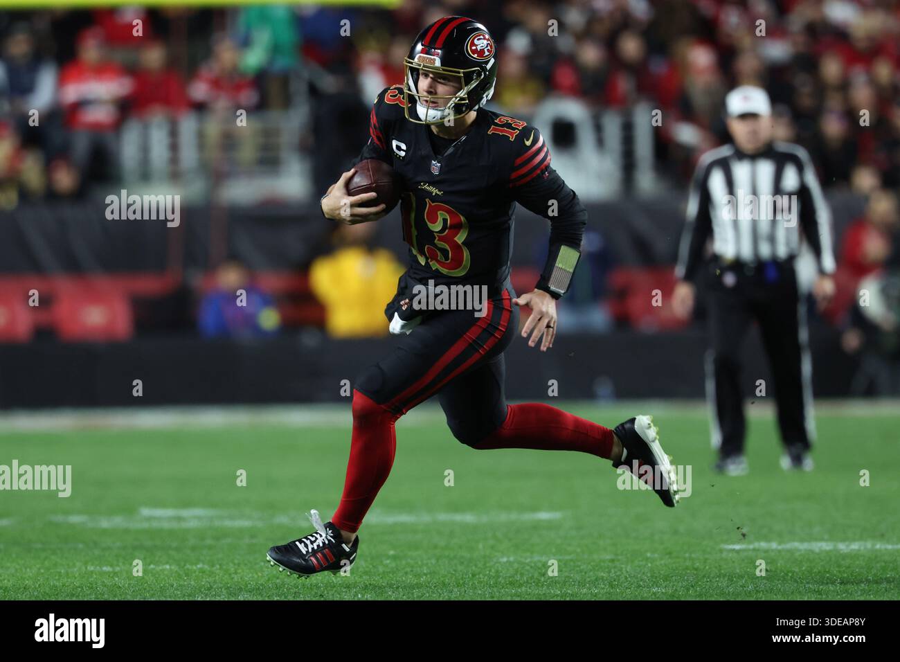 San Francisco 49ers quarterback Brock Purdy (13) runs against Seattle ...
