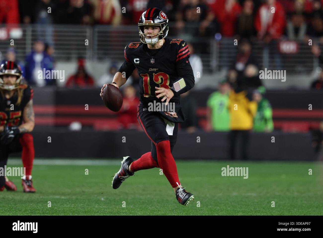 San Francisco 49ers quarterback Brock Purdy (13) runs against Seattle ...